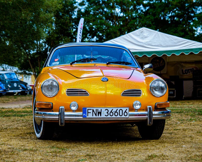 Orange Volkswagen Beetle Car on the Grass. Editorial Stock Image ...