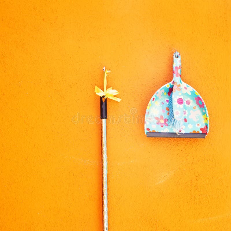 Orange Wall and Cleaning Utensil Stock Photo - Image of duster ...