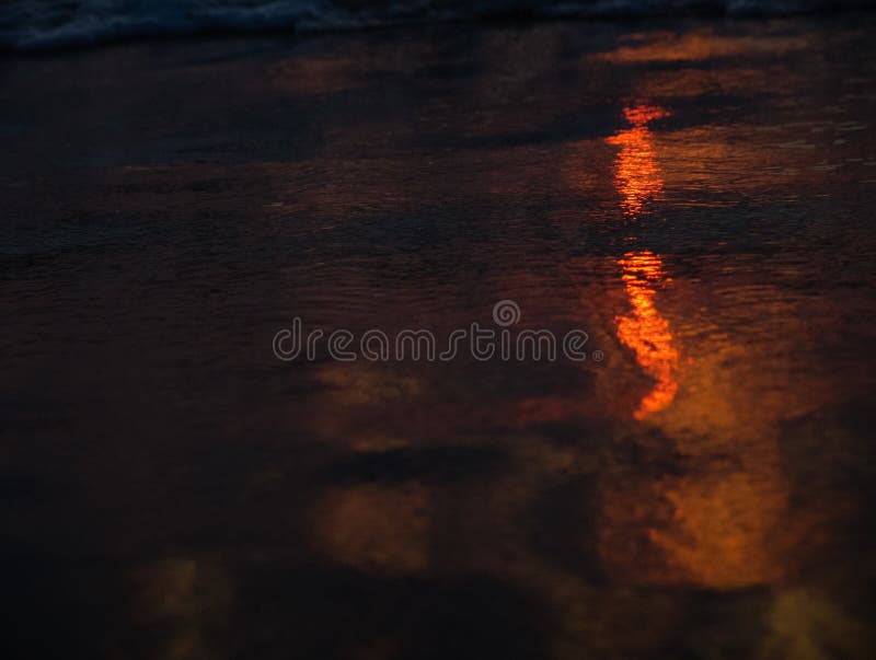 Orange Warm Sunset Reflections on Wet Sand on the Ocean Beach Stock ...