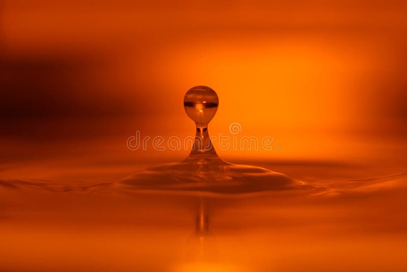Orange water drop stock image. Image of light, moment, drip - 25799