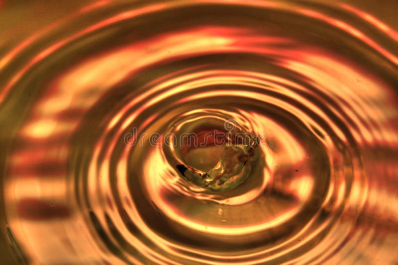 Orange Water Drop with Waves on the Surface. Stock Photo - Image of ...