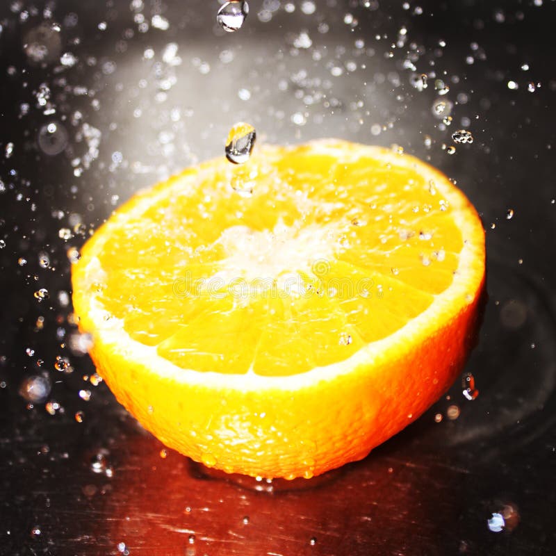 Orange with water splash stock image. Image of contrast - 49718439