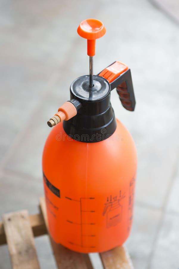 Orange Water Spraying Bottle Stock Photo - Image of tool, sprayer: 81127286