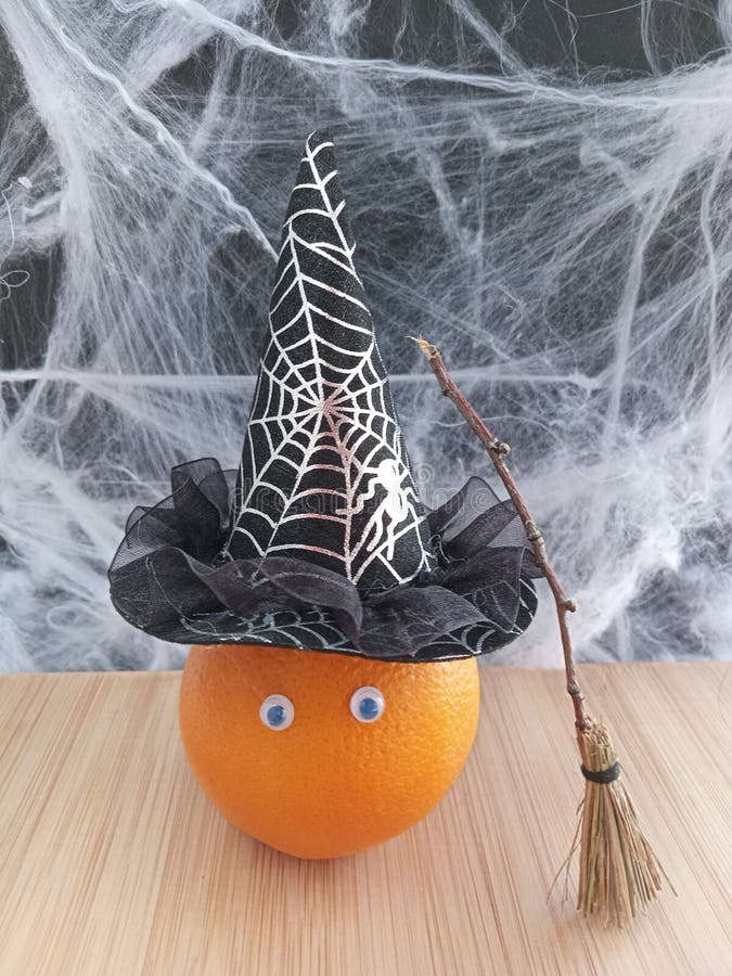 Orange Wearing a Witch Hat with Broom As a Halloween Character Stock ...