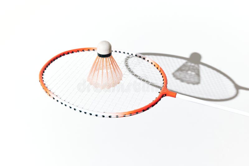 Orange and White Badminton Racket and Ball Casting a Shadow on a White ...