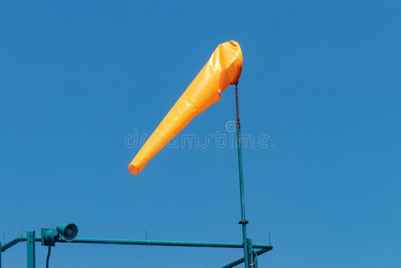 Orange Wind Sock Blowing in the Sunlight in Springtime Stock Photo ...