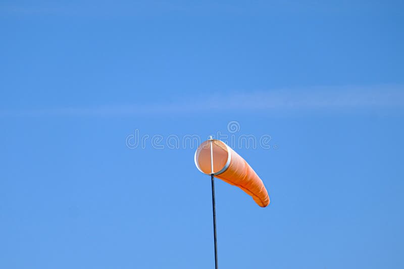 Orange Wind Sock Flying in the Wind To Show Wind Direction Stock Photo ...