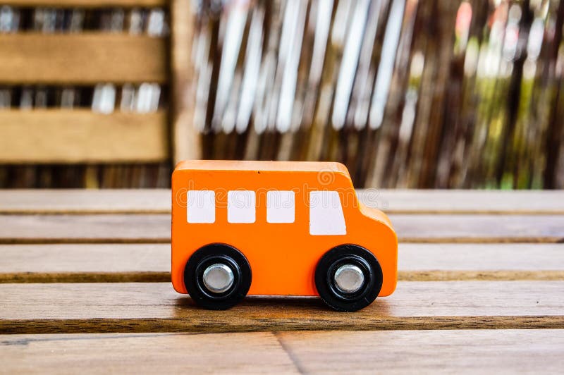 Orange wooden toy bus stock photo. Image of simple, wood - 79365124