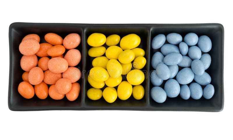 Bright Chocolate Covered Peanuts in Bowl, Isolated Over White Stock ...