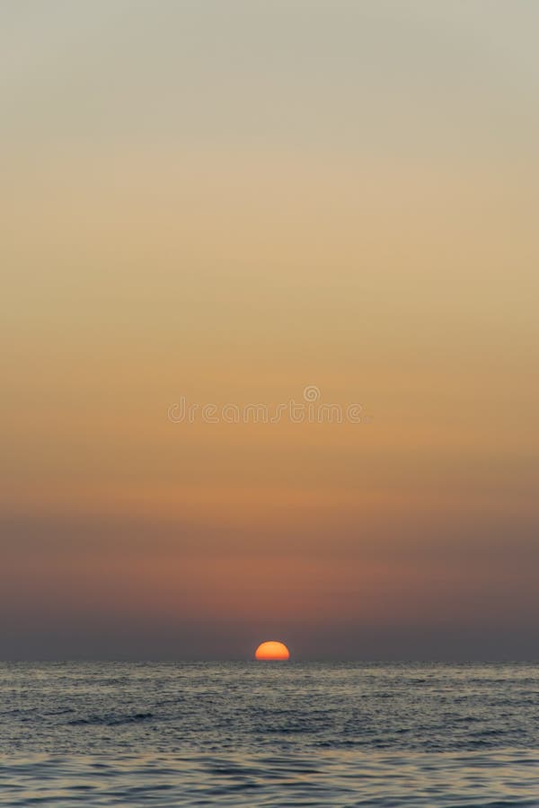 Orange Yellow Sun Sunsets Over Blue Clear Sky on the Open Sea 3 Stock ...