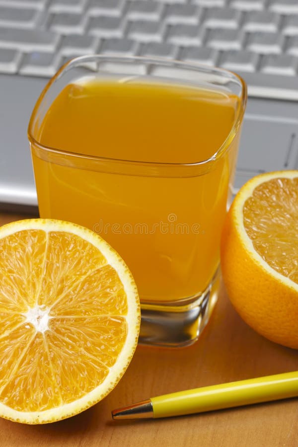 Oranges, juice and laptop stock image. Image of composition - 11844567
