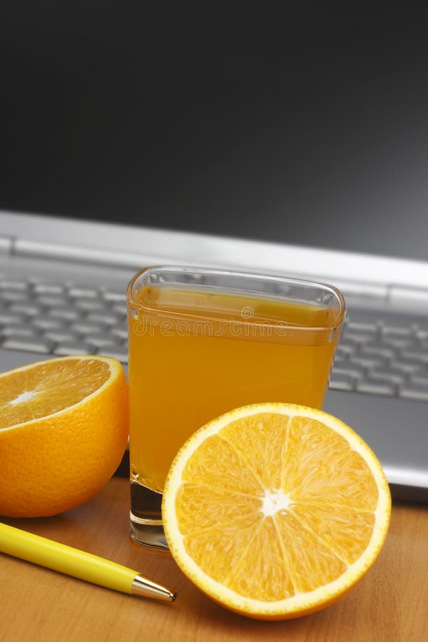 Oranges, juice and laptop stock photo. Image of concept - 11869296