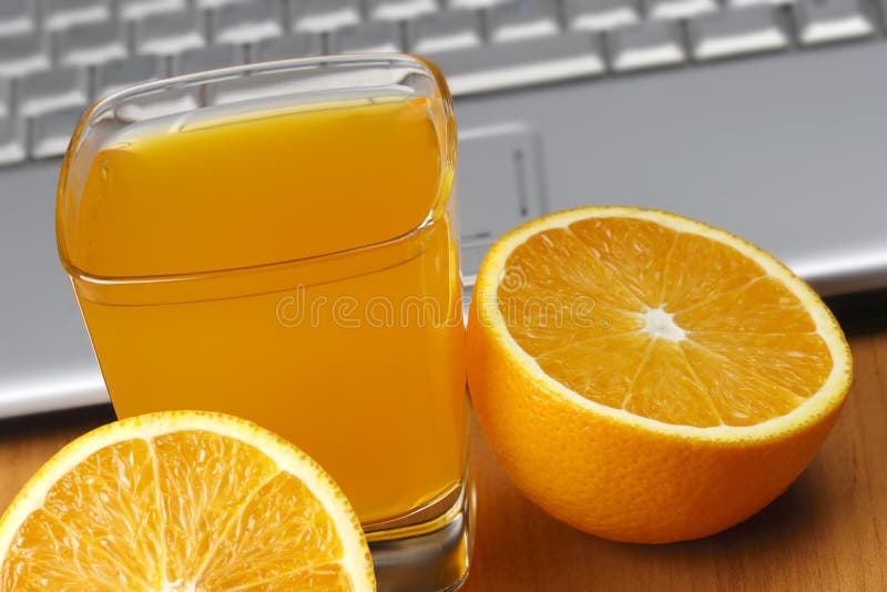 Oranges, juice and laptop stock image. Image of freshness - 11882145
