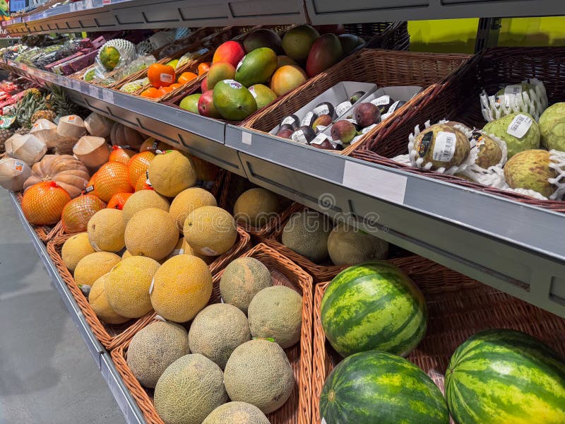 Oranges and Lemons on the Shelves of a Fruit Store. Stock Image - Image ...