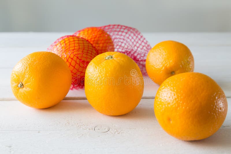 Oranges on the net stock photo. Image of vitamins, wood - 34603324