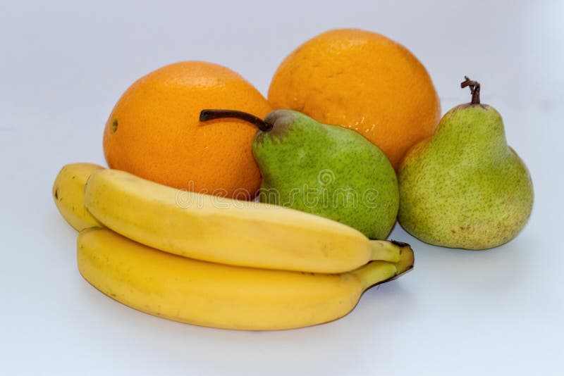 Oranges, Pears and Bananas on a White Isolated Background Stock Image ...
