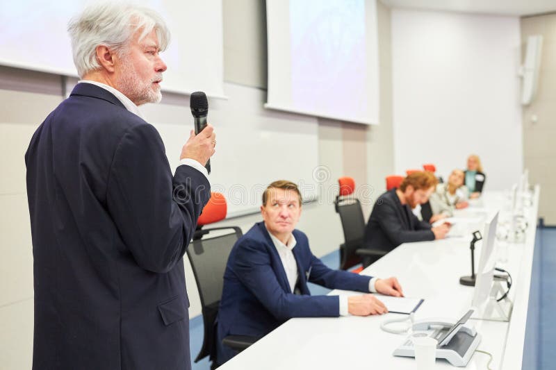 Orator on Stage Giving Speech during Business Event Stock Photo - Image ...