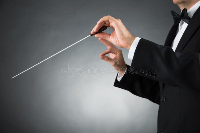 Orchestra Conductor Holding Baton Stock Image - Image of instruction ...