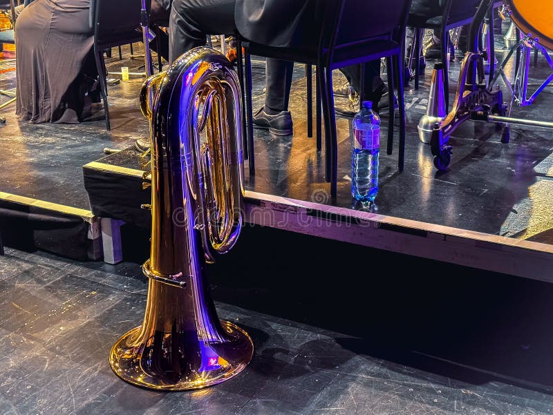 Orchestra Tuba at Rest beside Musicians on Stage during Concert ...