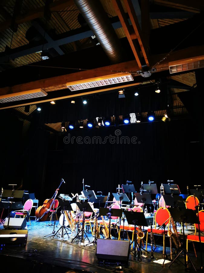 Orchestral Setup with Chairs and Instruments Arranged in a Concert Hall ...