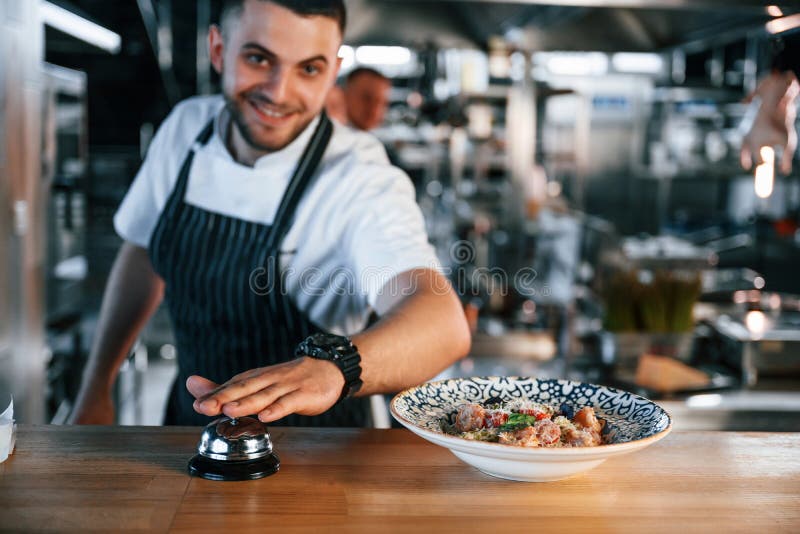 Order is Complete. Kitchen Workers is Together Preparing the Food Stock ...