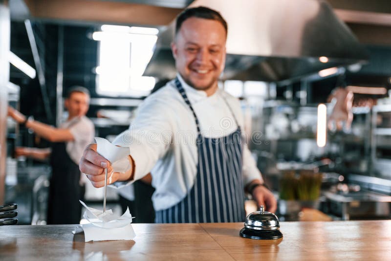 Order is Complete. Kitchen Workers is Together Preparing the Food Stock ...