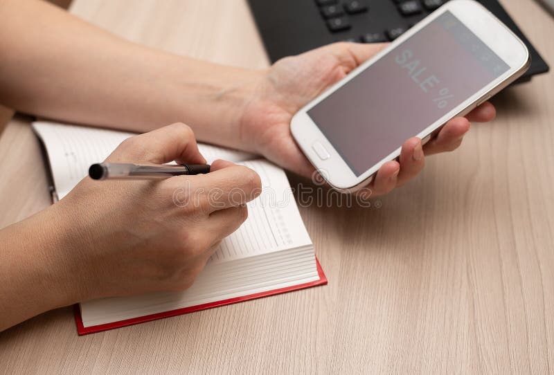 Order a Discount Via Phone, Record in a Notebook, Write Down with a Pen ...