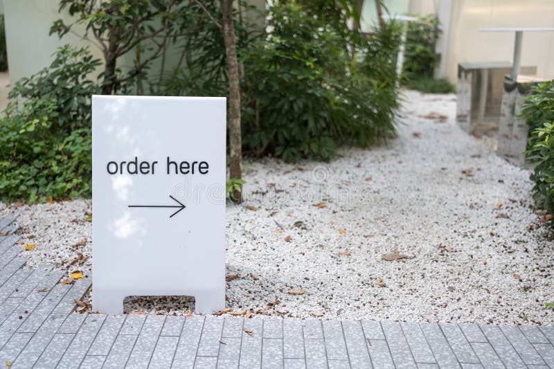 Order Here Sign at Cafe Restaurant Stock Image - Image of door, board ...