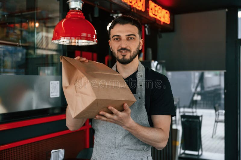 Order in Package is Ready. Man is Serving Delicious Street Food Stock ...