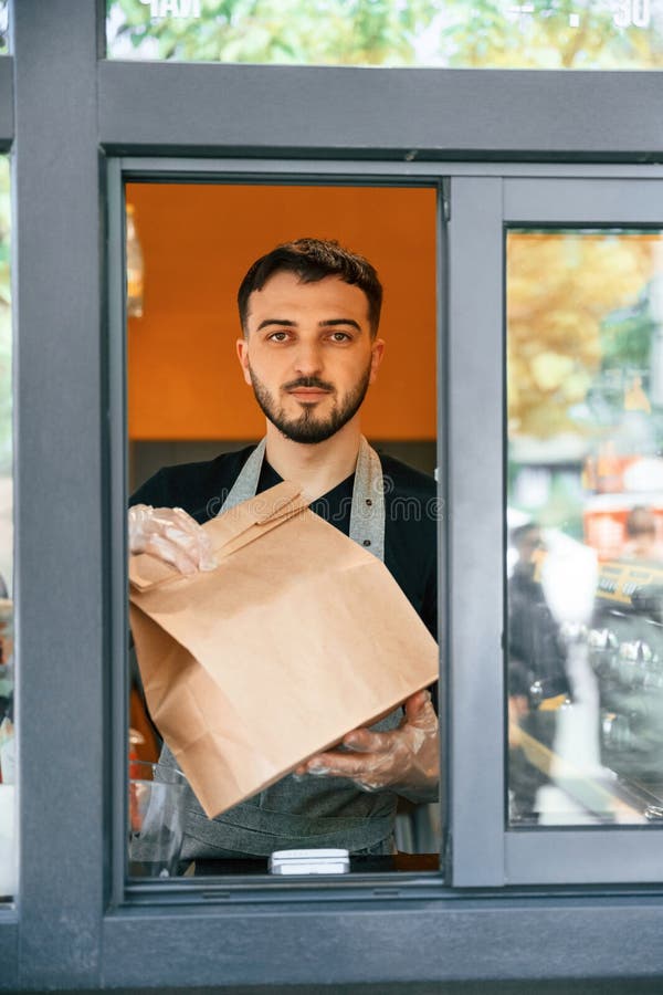 Order in Package is Ready. Man is Serving Delicious Street Food Stock ...