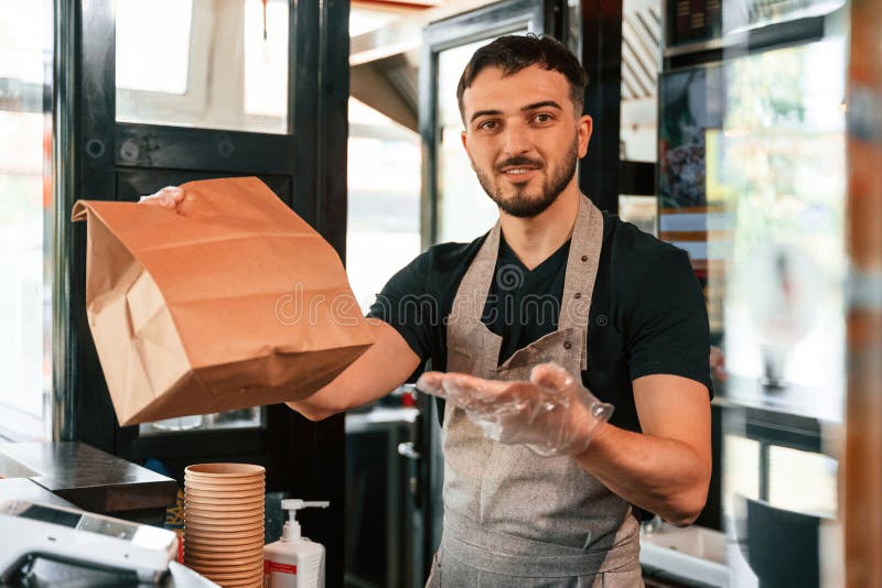 Order in Package is Ready. Man is Serving Delicious Street Food Stock ...