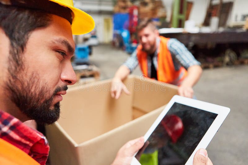 Order Picker Checks Incoming Goods on the Tablet Computer Stock Photo ...