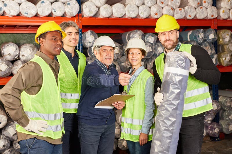 Order Pickers and Colleagues in the Logistics Team Stock Photo - Image ...