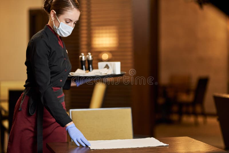 Orderly Restaurant Staff Working in a Protective Mask Stock Image ...