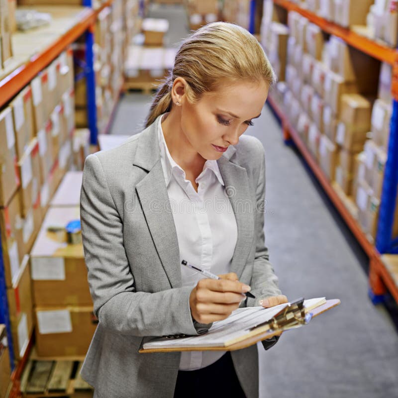 Orders Being Processed. a Woman at Work in a Storage Warehouse. Stock ...