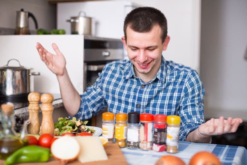 Ordinary Guy Chooses Spices in the Kitchen at Home Stock Photo - Image ...