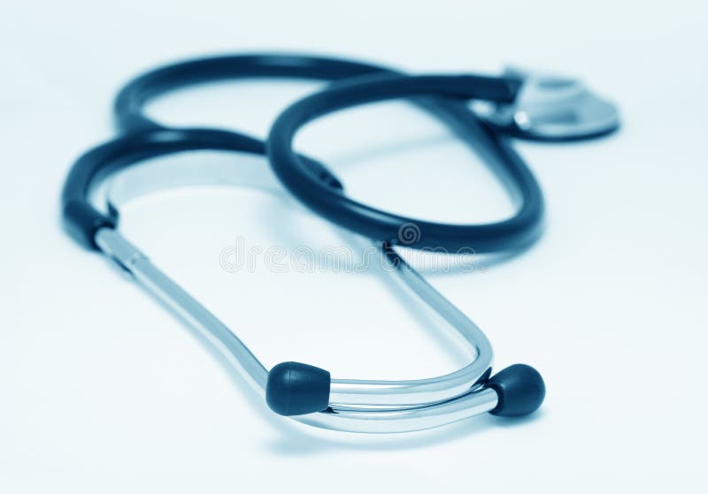 A Stethoscope on Blue Background with a Spring Flowers Stock Image ...