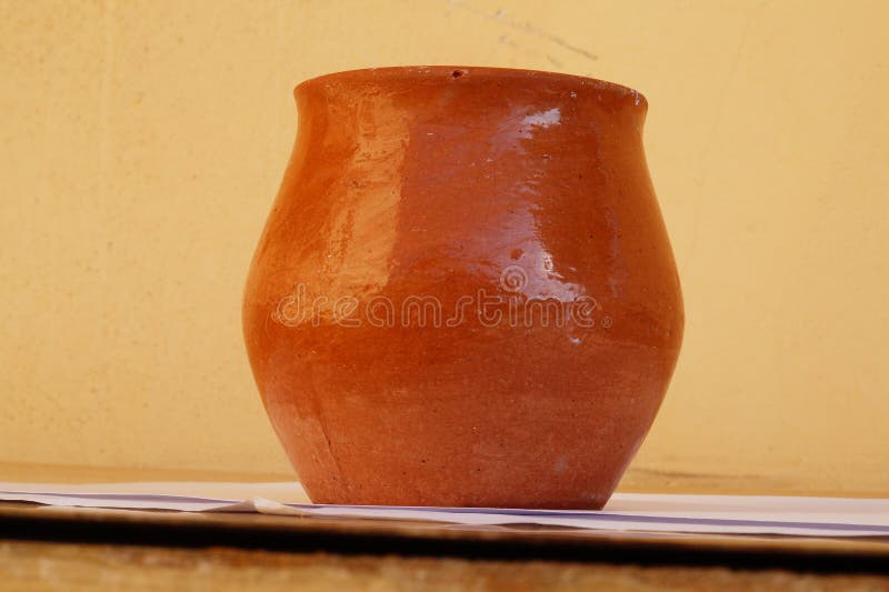 An Ordinary Simple Clay Pot of Red and Brown Color with a Glossy ...