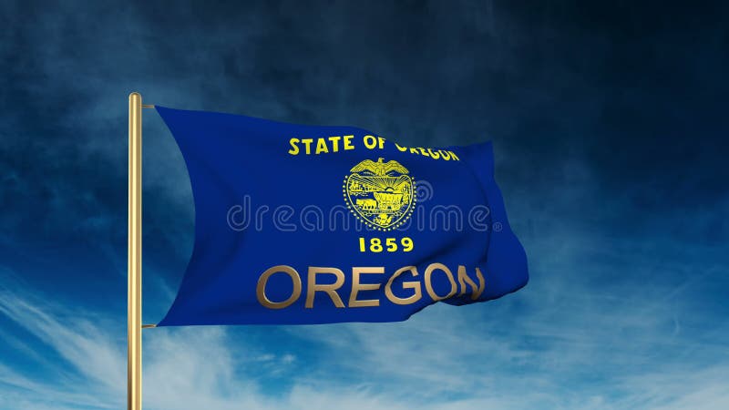 Oregon Flag on a Flagpole Waving in the Wind, Blue Sky Background Stock ...