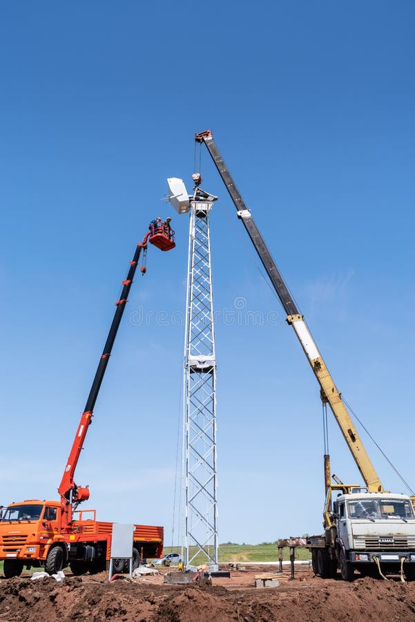 Construction Site, Workers Using Construction Equipment Install a Wind ...