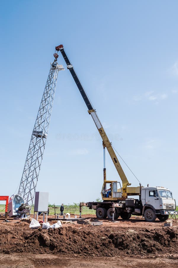 Construction Site, Workers Using Construction Equipment Install a Wind ...