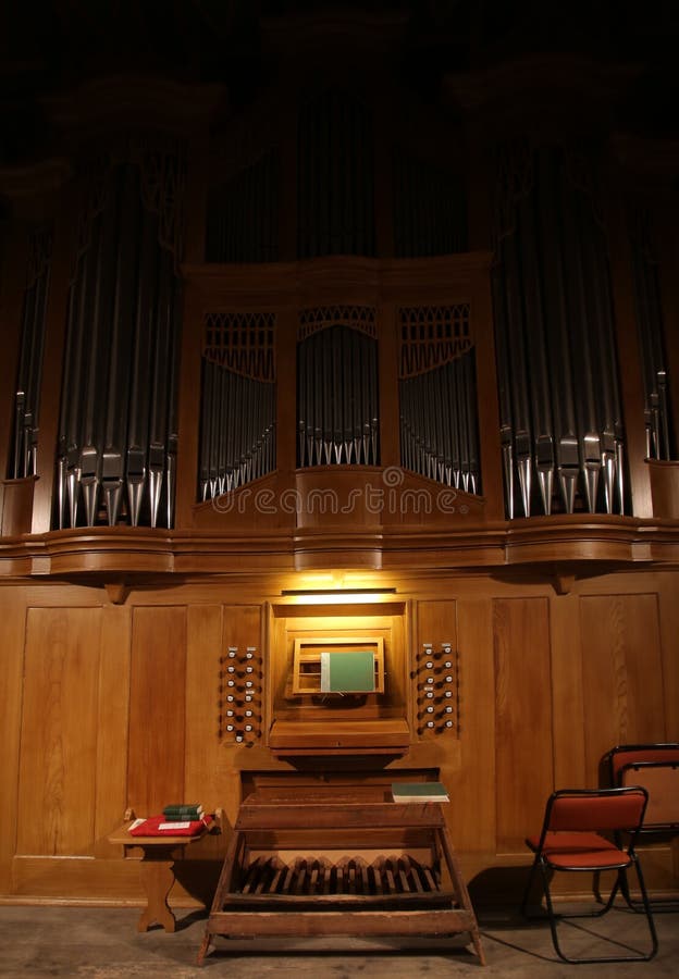 Organ Console with Various Books and Pipes on the Top Stock Image ...