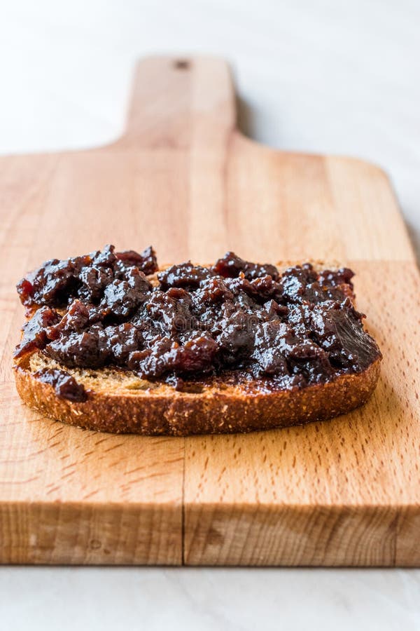 Organic Apple Molasses / Raw Fruit Paste Jam with Bread Stock Photo ...