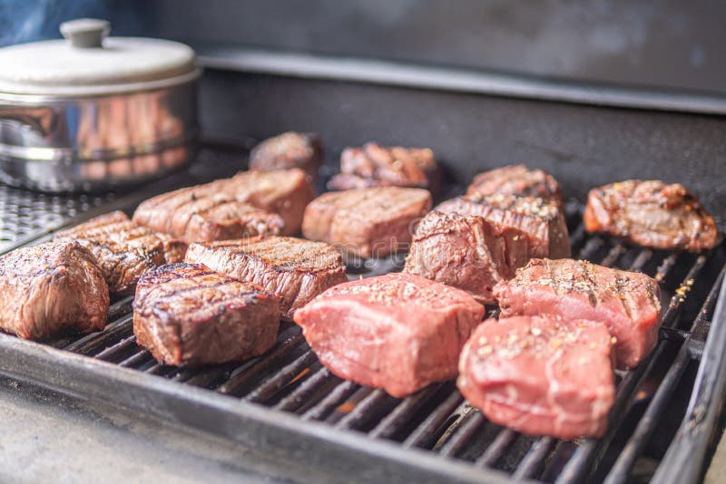 Organic Beef Stakes Grilled for a Party Stock Photo - Image of barbecue ...