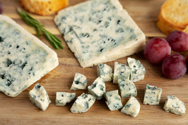 Organic Blue Cheese with Grapes on a Wooden Board, Side View Stock ...