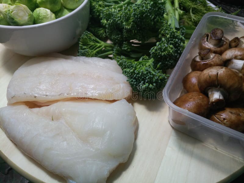 Close Up of Raw Cod Fish on a Surface Stock Photo - Image of brocoli ...