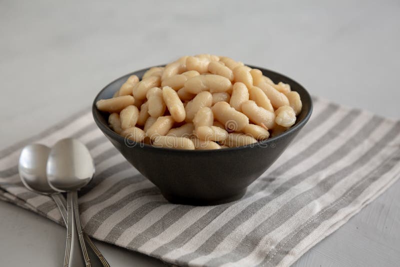 Organic Cannellini Beans in a Bowl, Side View Stock Photo - Image of ...