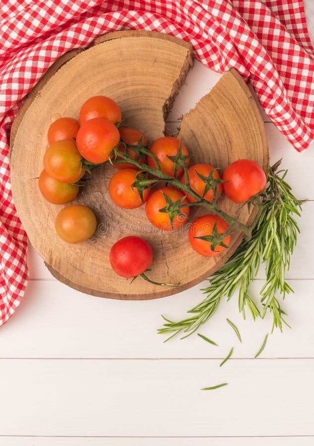 Organic Cherry Tomatoes with Rosemary on Rustic Wooden Table Stock ...