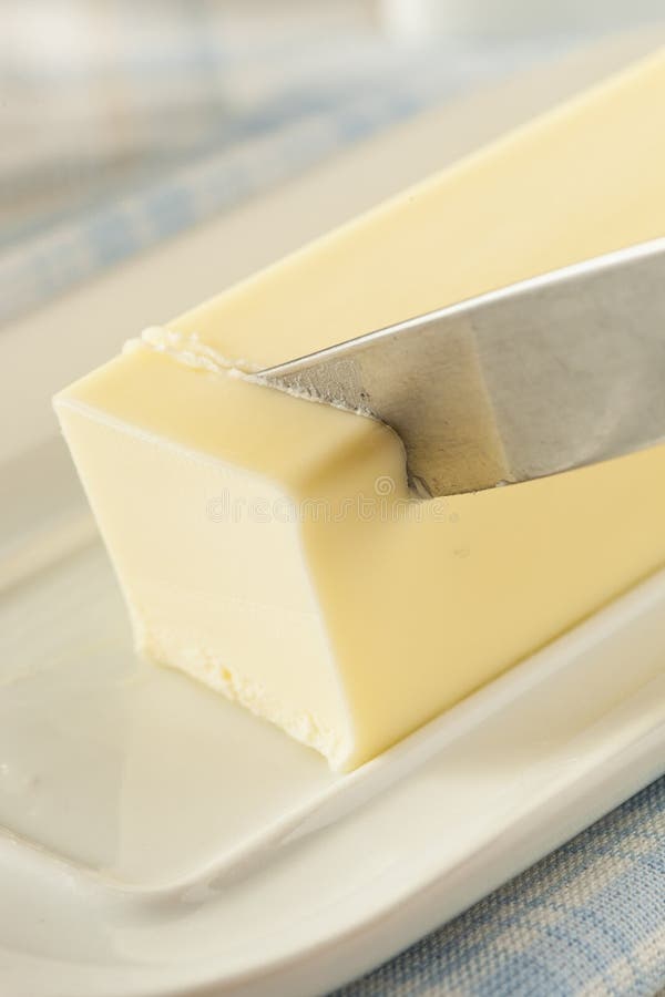 Organic Dairy Yellow Butter Stock Image - Image of slice, curl: 36441877