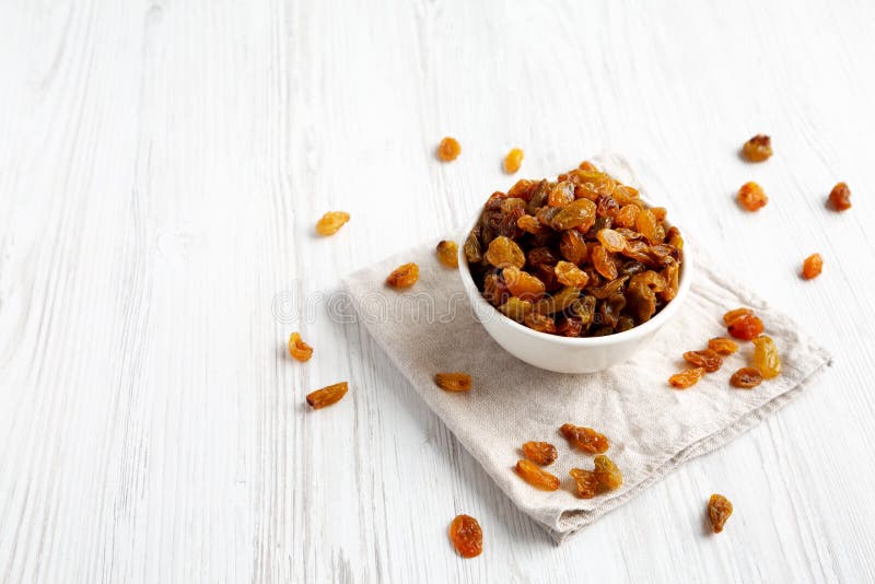 Organic Dried Raisins in a White Bowl, Side View. Space for Text Stock ...
